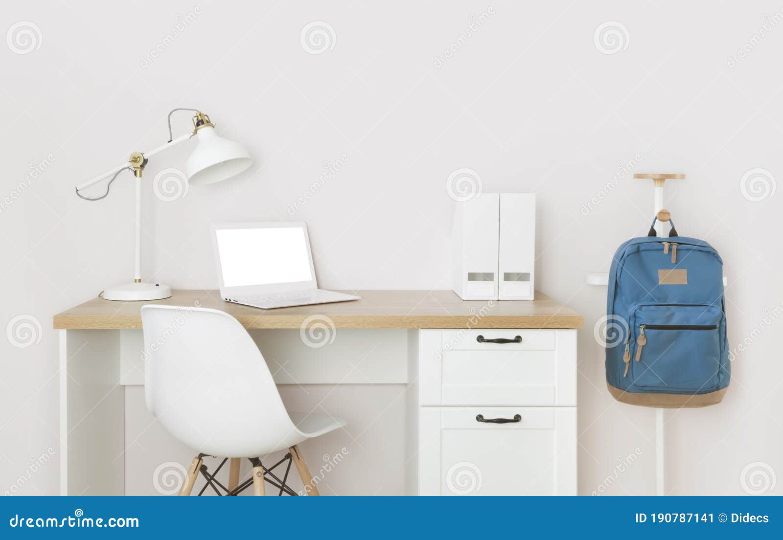 School Table, Notebook Computer, Chair and Backpack Hanging on Rack ...