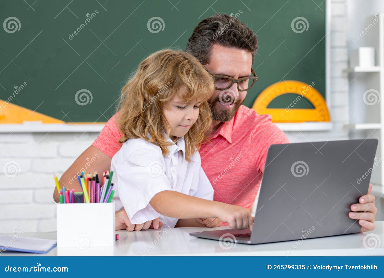 School Teacher and Child Pupil Learning at Laptop Computer, Studying ...