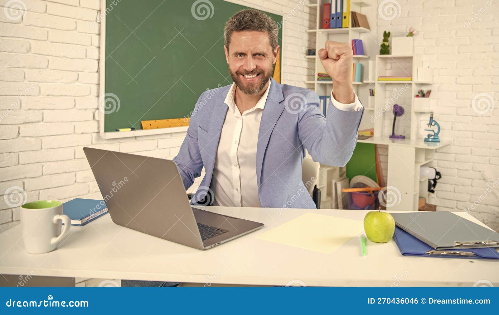 School Teacher in Classroom with Computer at Blackboard. Success Stock ...