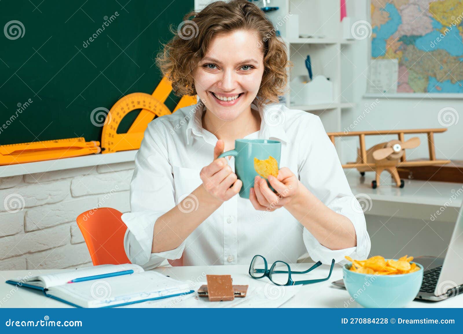 School Teacher Eating in Classroom. Lunch Time. Education Concept ...