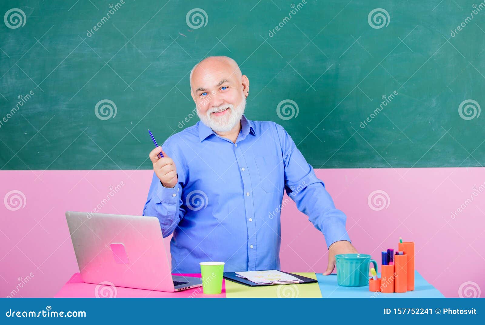 School Teacher Programming with Laptop. Handsome Man Use Modern ... School Teacher Programming with Laptop. Handsome Man Use Modern ...