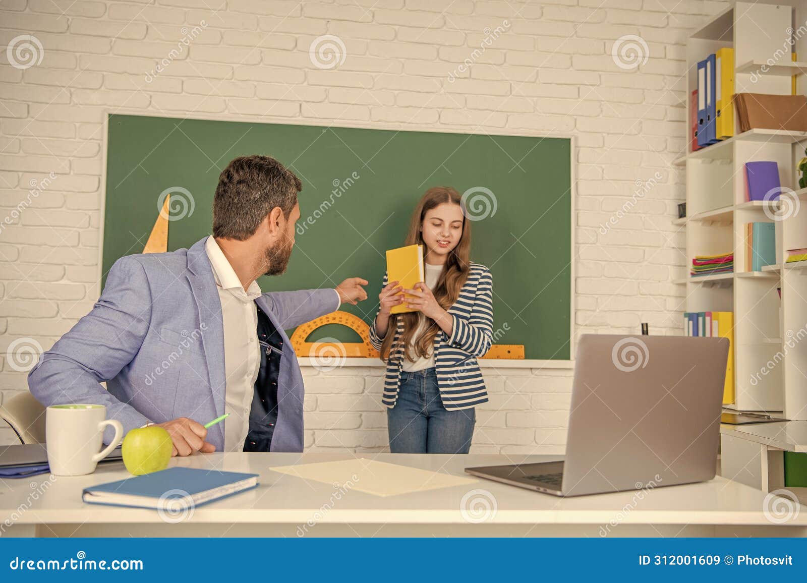 School Teacher with Selective Focus of Child at Blackboard. Point ...
