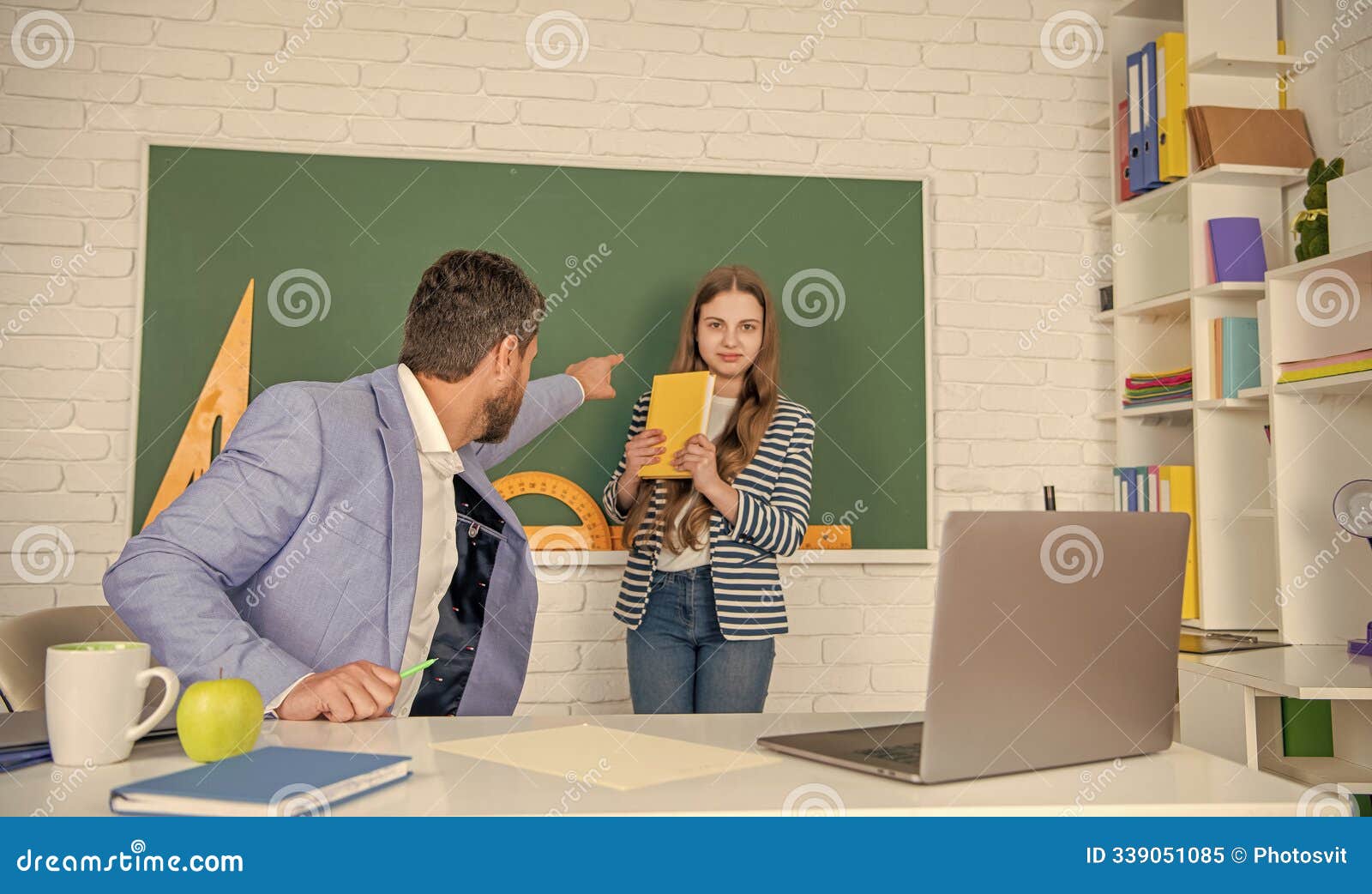 School Teacher with Selective Focus of Child at Blackboard. Pointing ...