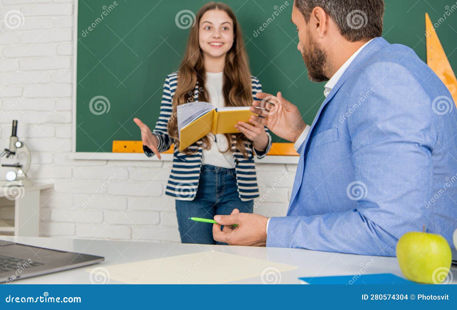 School Teacher with Selective Focus of Smiling Child at Blackboard ...