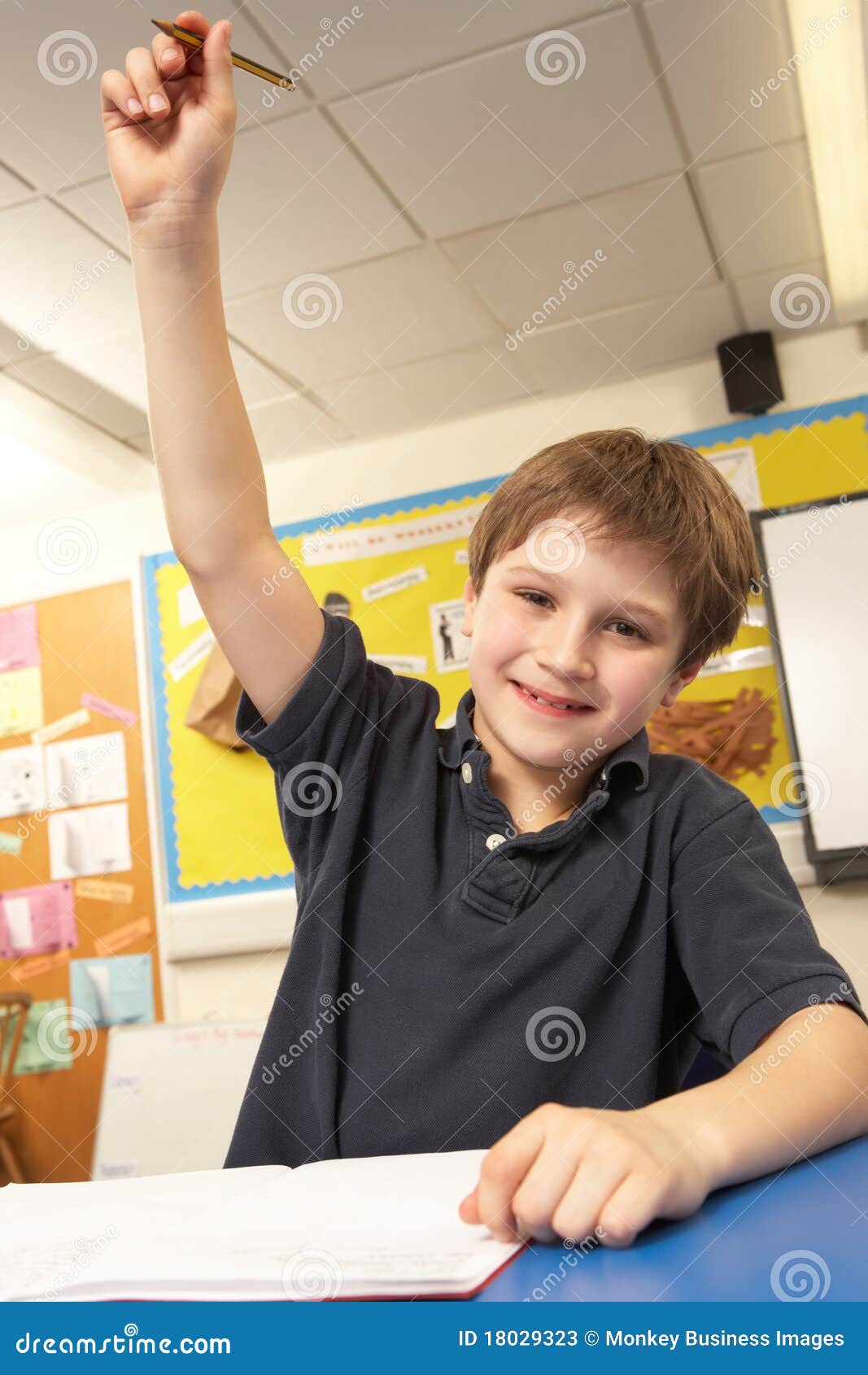 Schoolboy Answering Question in Classroom Stock Image - Image of ...