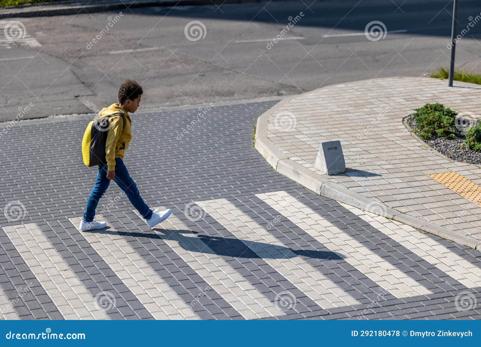 Schoolboy with Backpack on His Back Crossing the Street Stock Photo ...