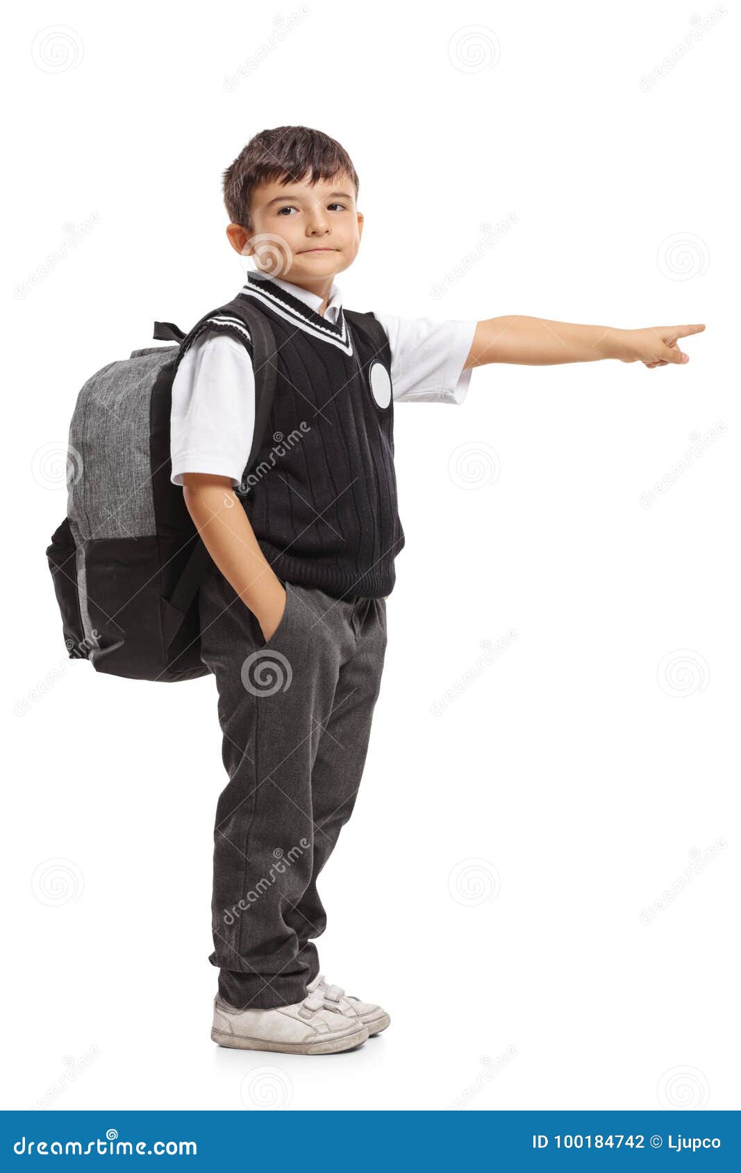 Schoolboy with a Backpack Pointing Stock Photo - Image of child ...