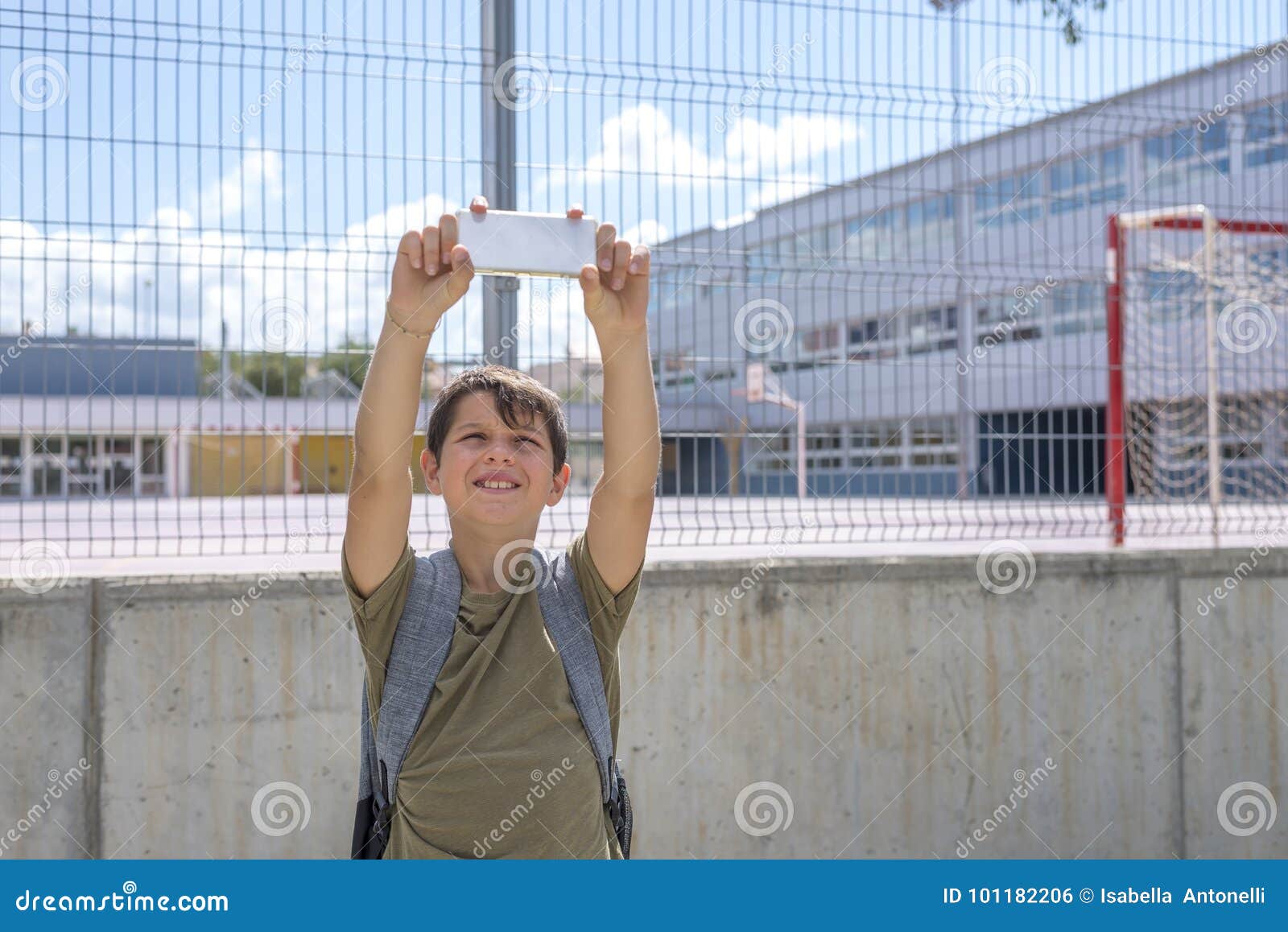 Schoolboy on Bench Taking Break Using Mobile Stock Photo - Image of ...