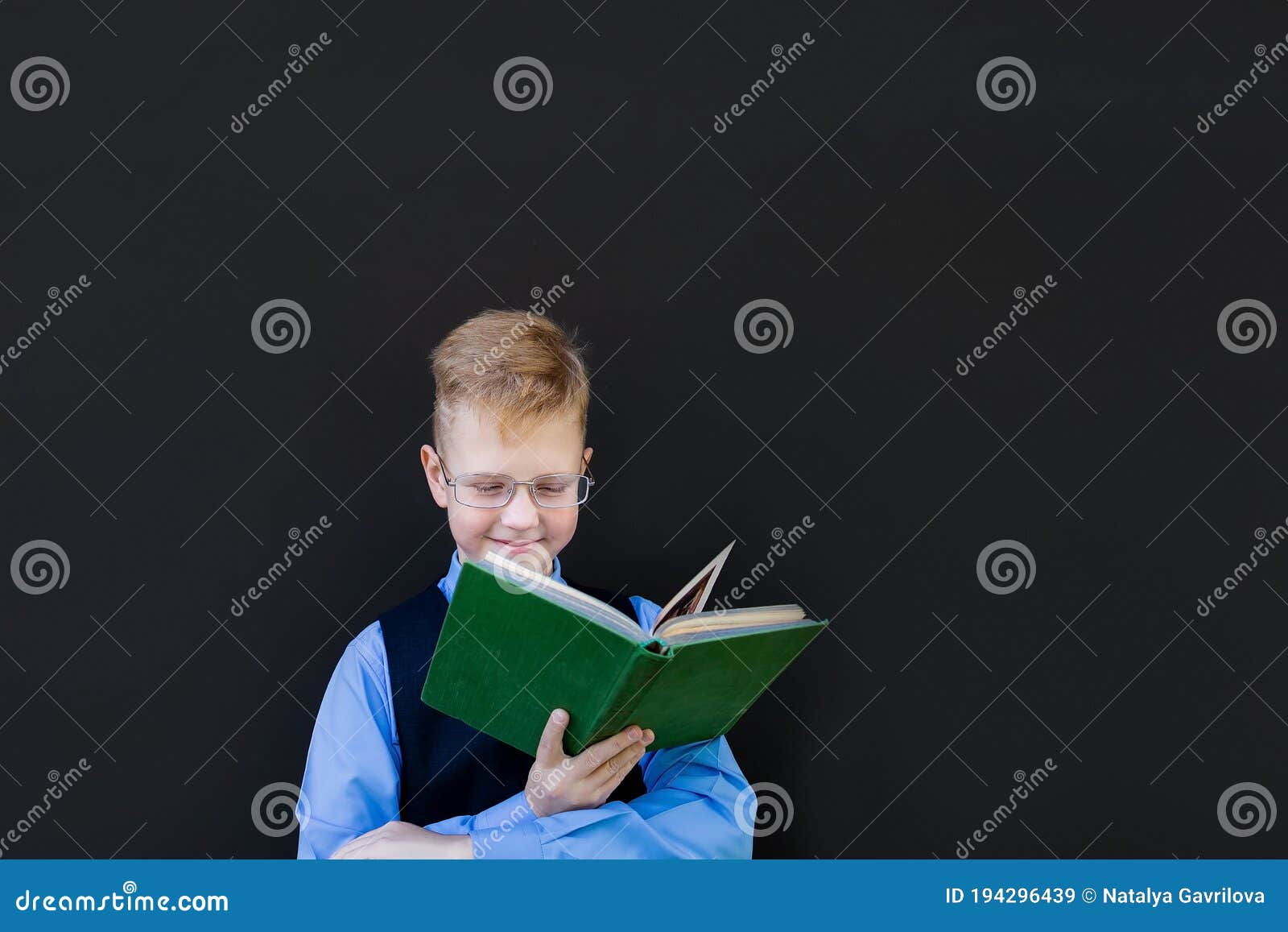 Schoolboy with a Book on a Black Background Stock Image - Image of ...
