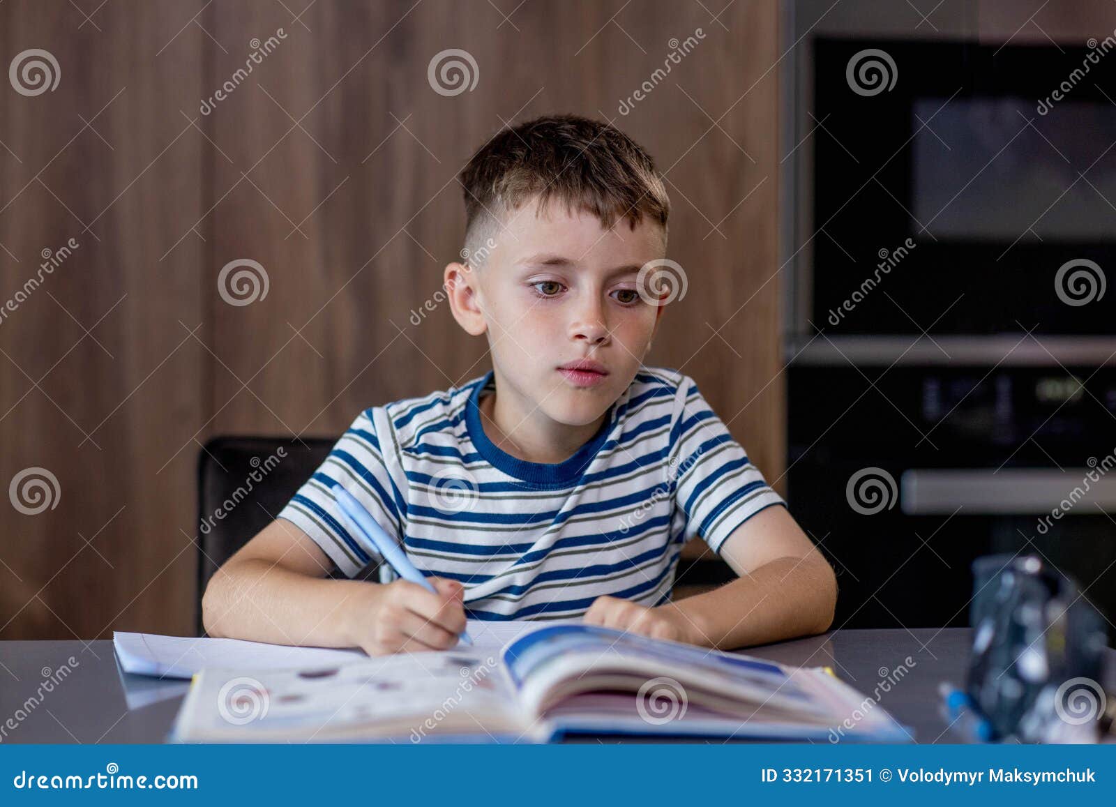 Schoolboy Boy Writes Lessons in the Kitchen Stock Image - Image of ...