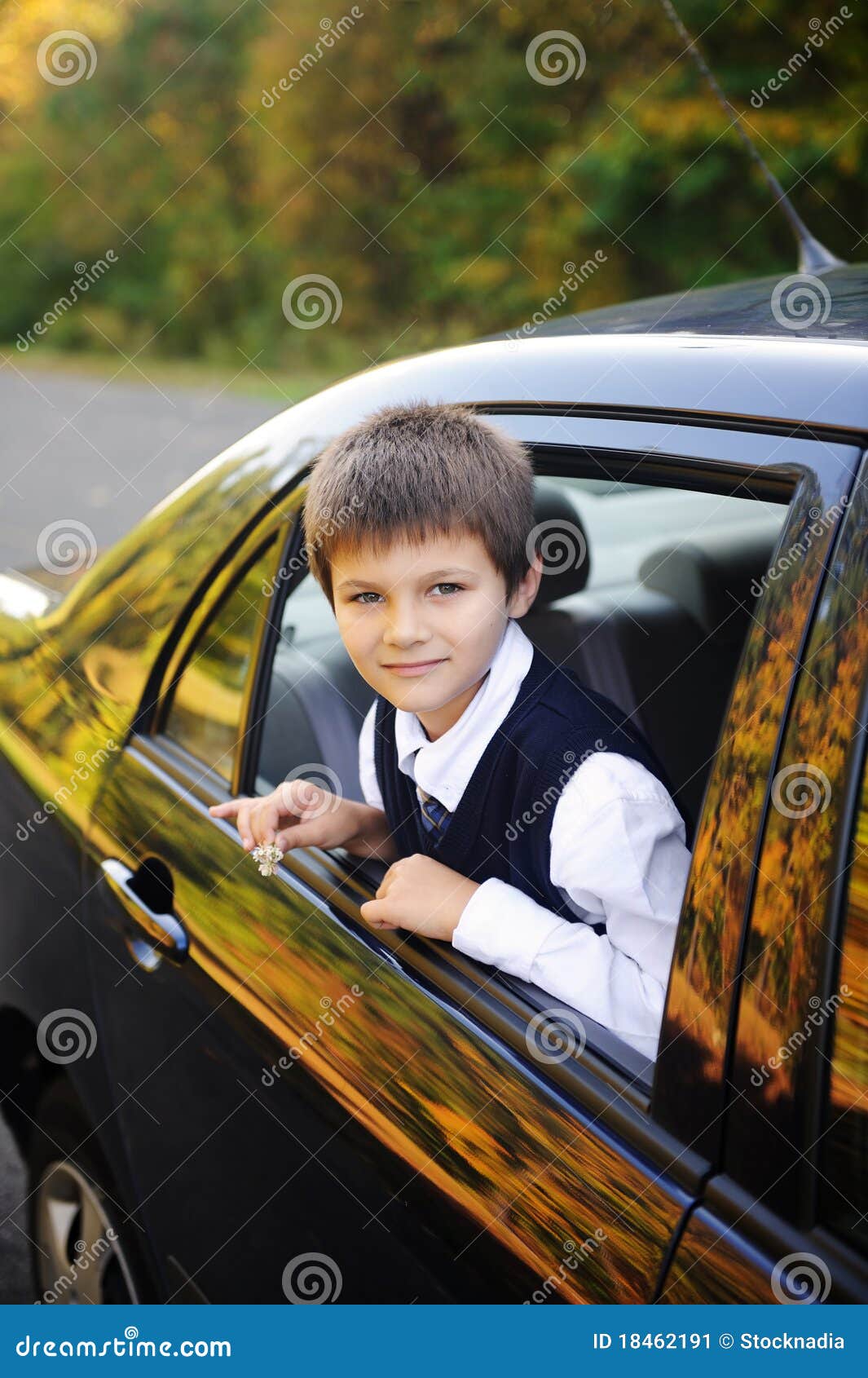 Schoolboy into the car stock image. Image of autumn, look - 18462191