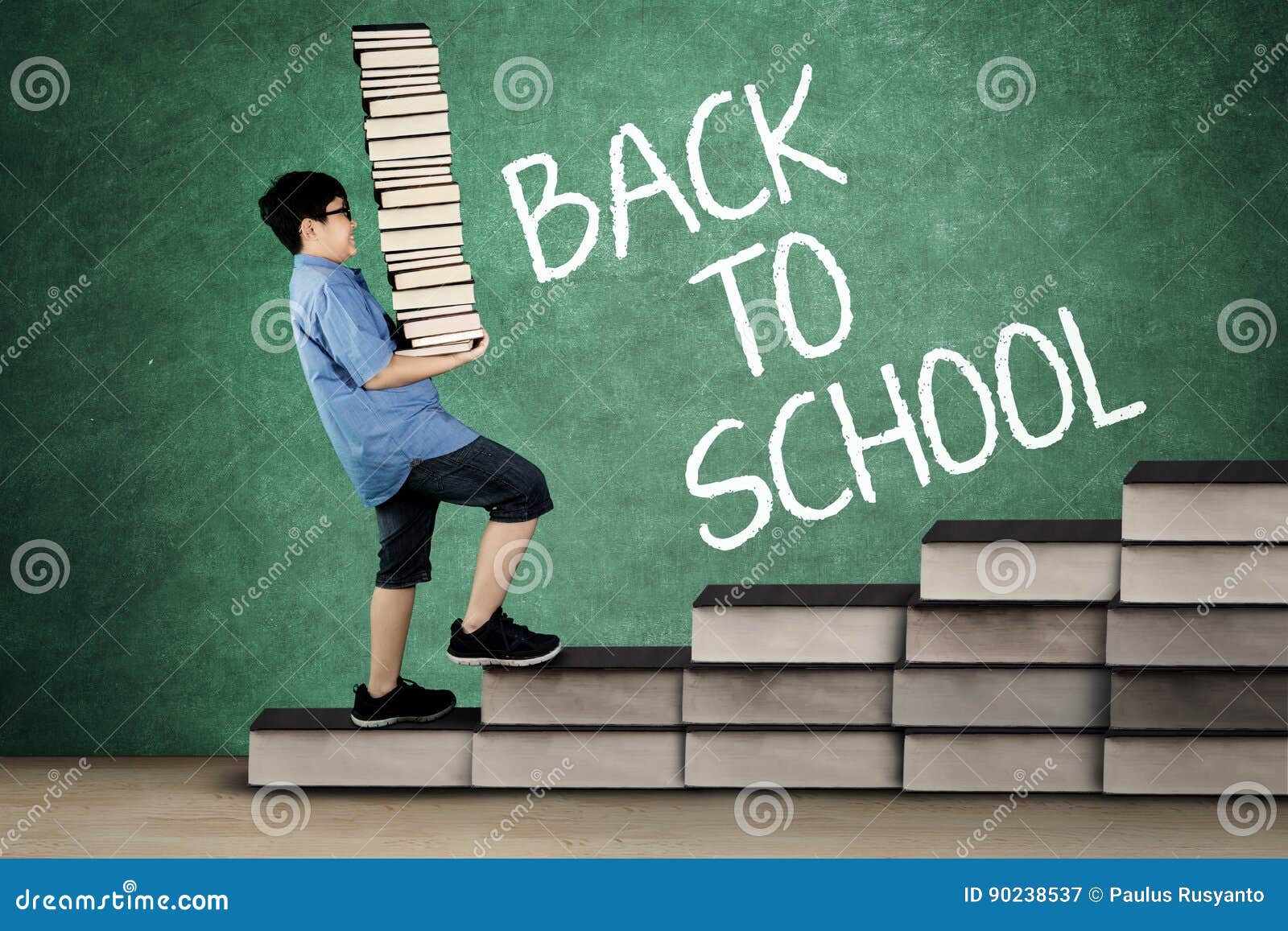 Schoolboy Carrying Stack of Books on Stair Stock Image - Image of ...