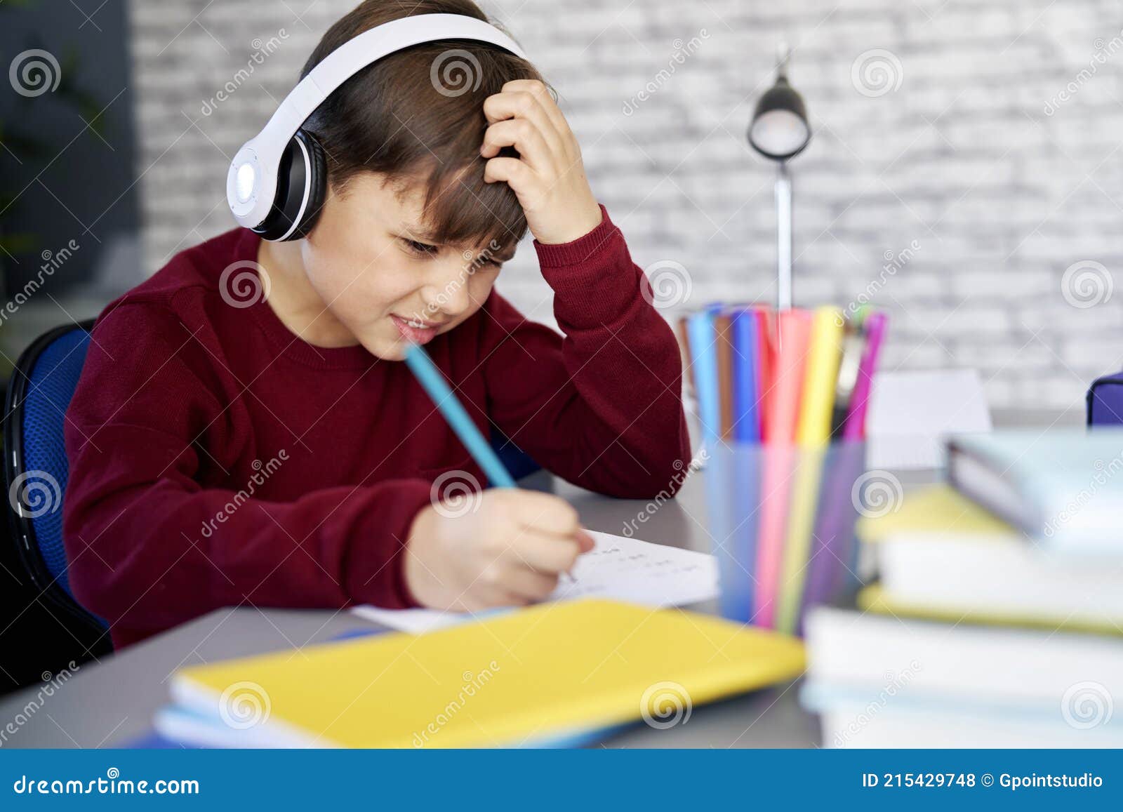 Schoolboy Doing Homework With Notebook Stock Photo | CartoonDealer.com ...
