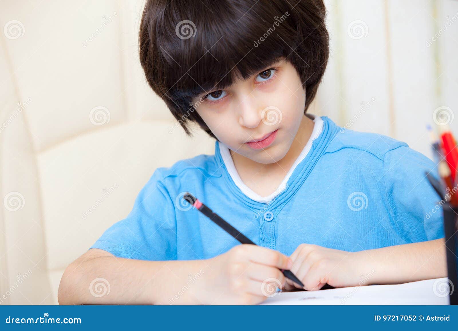 Schoolboy Doing Homework with Pen Stock Photo - Image of reading ...