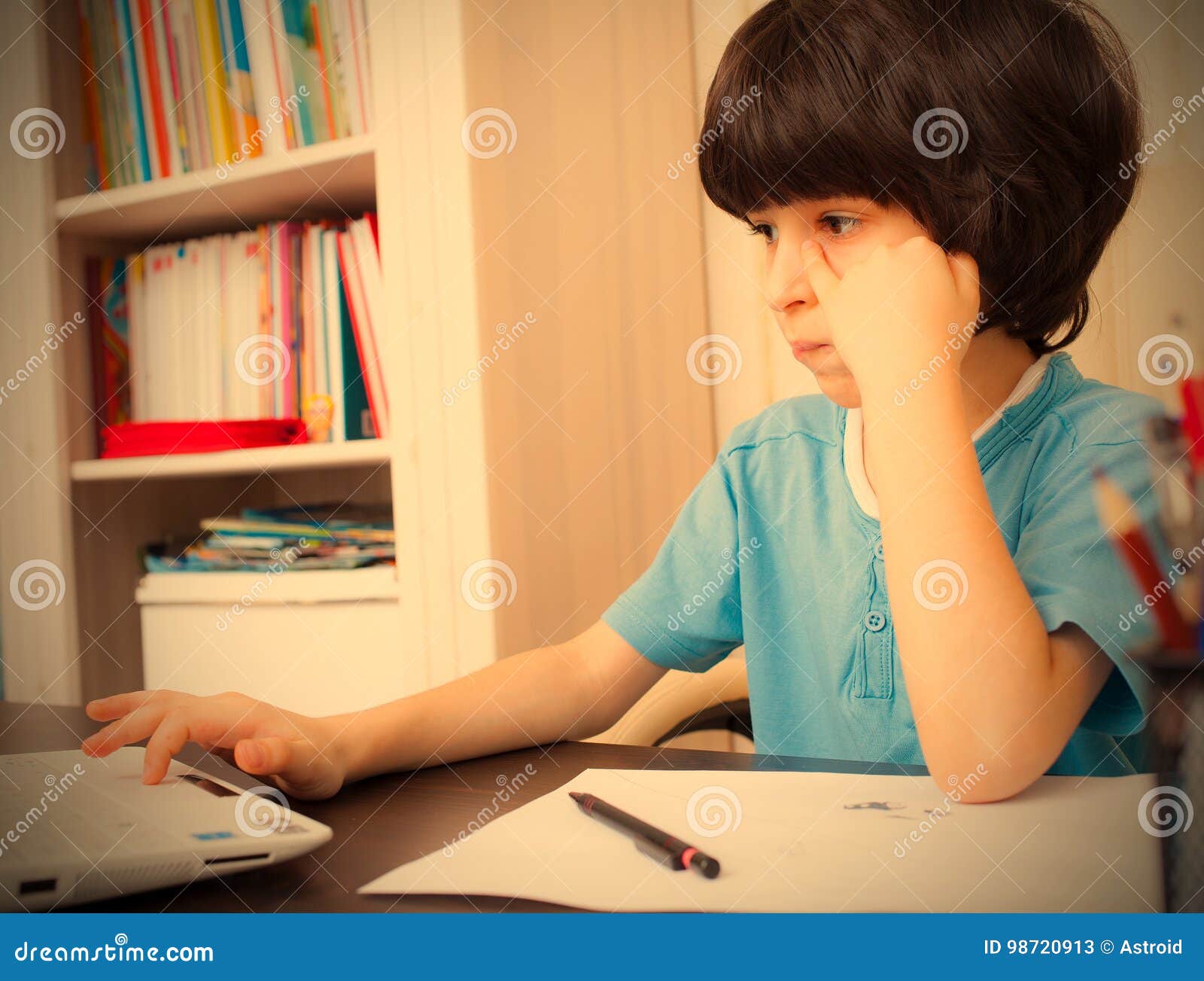 Schoolboy doing homework stock image. Image of male, education - 98720913