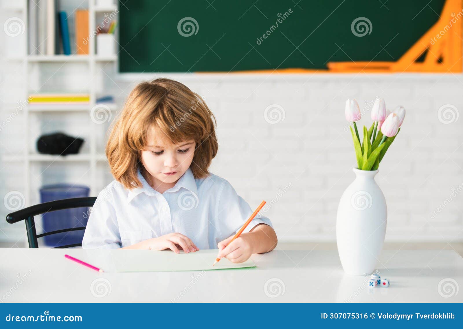 Schoolboy Doing Homework. School Kid Against Green Chalkboard. Gets ...