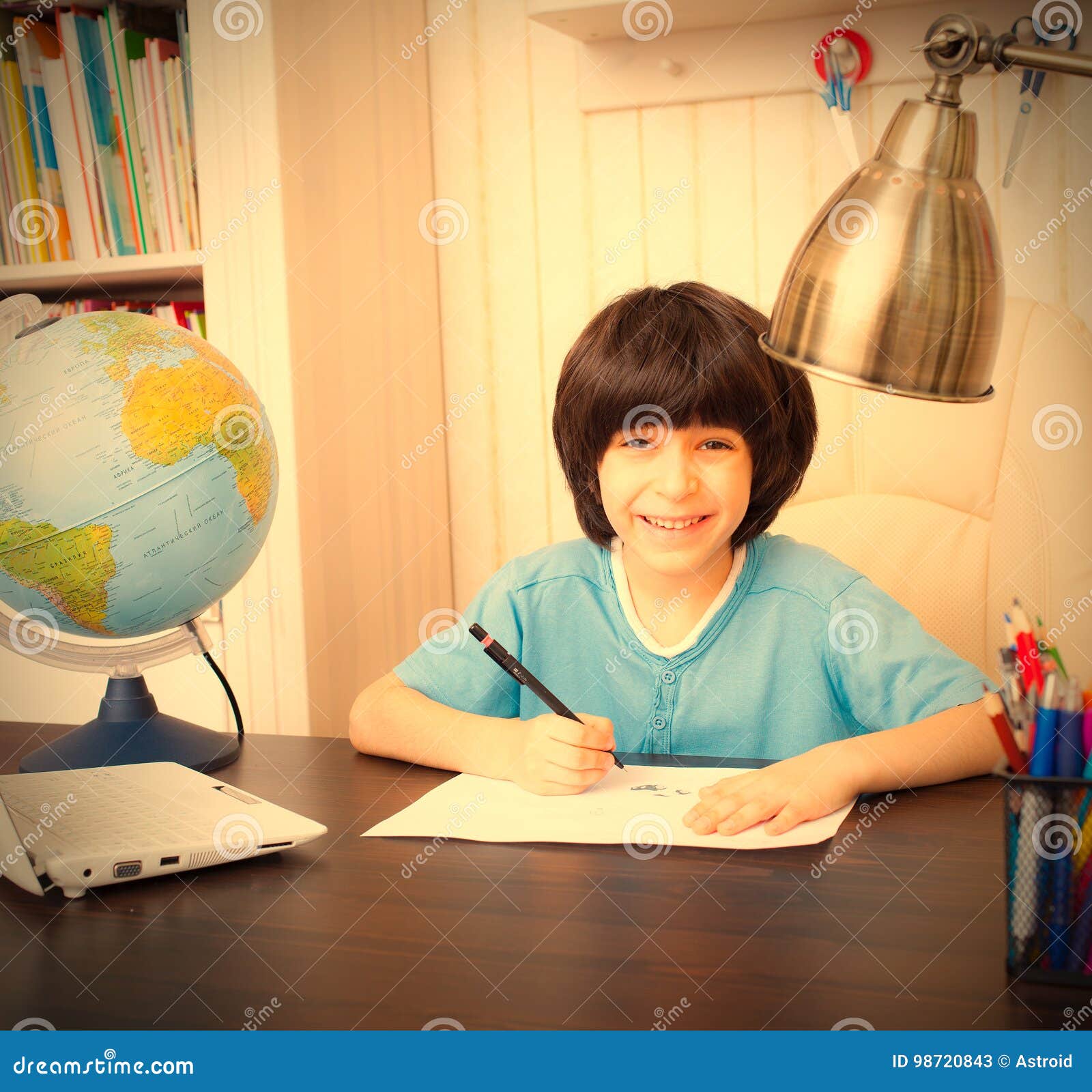 Schoolboy doing homework stock image. Image of file, happy - 98720843
