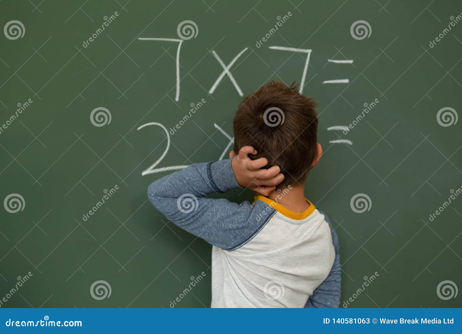 Schoolboy Doing Math on Greenboard in a Classroom Stock Image - Image ...