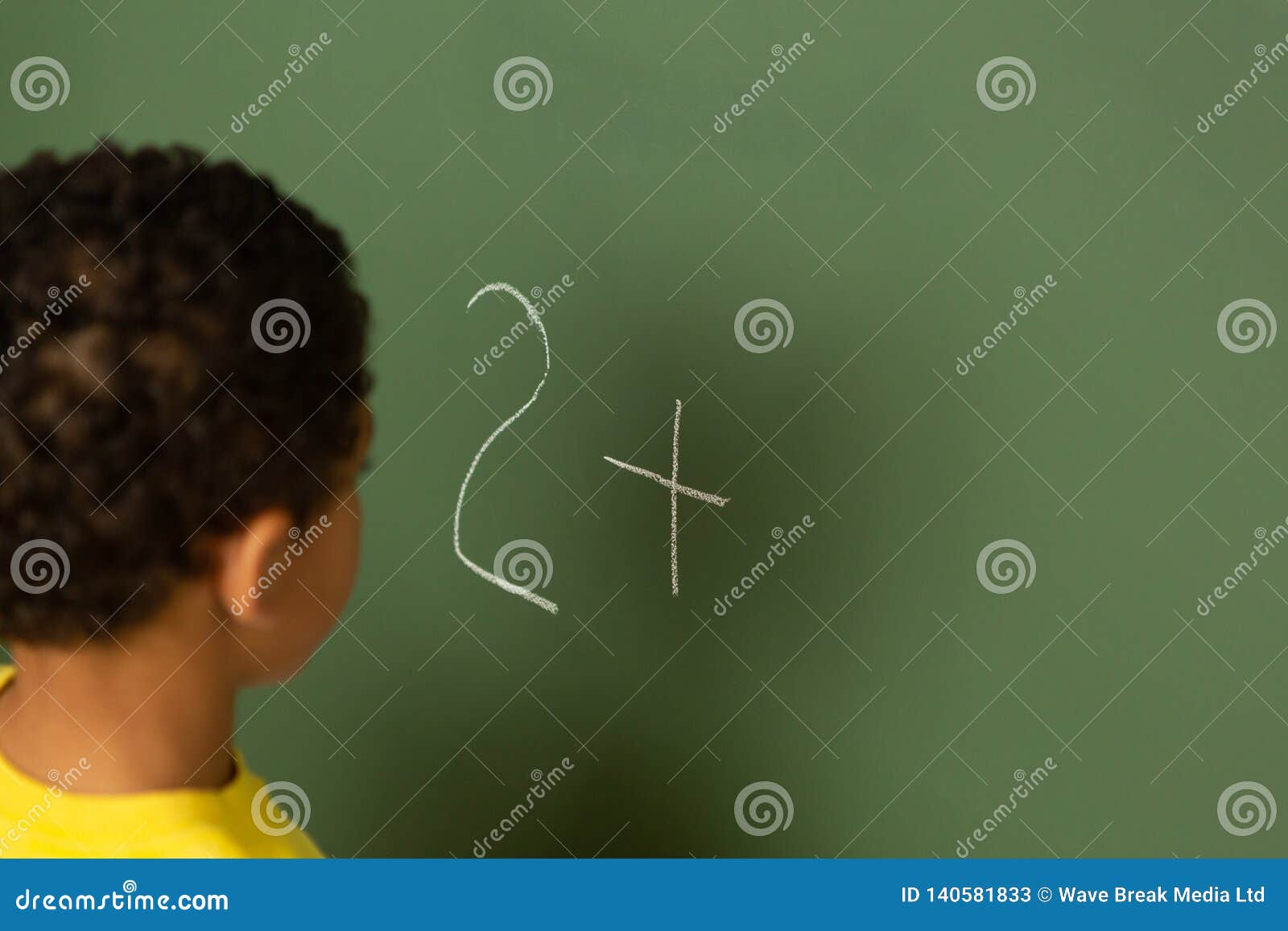 Schoolboy Doing Math on Greenboard in a Classroom Stock Image - Image ...