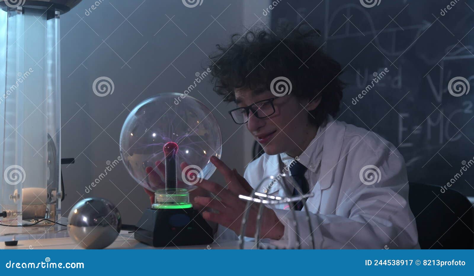 Schoolboy Experimenting in Physics Class. Young Student Doing Physics ...