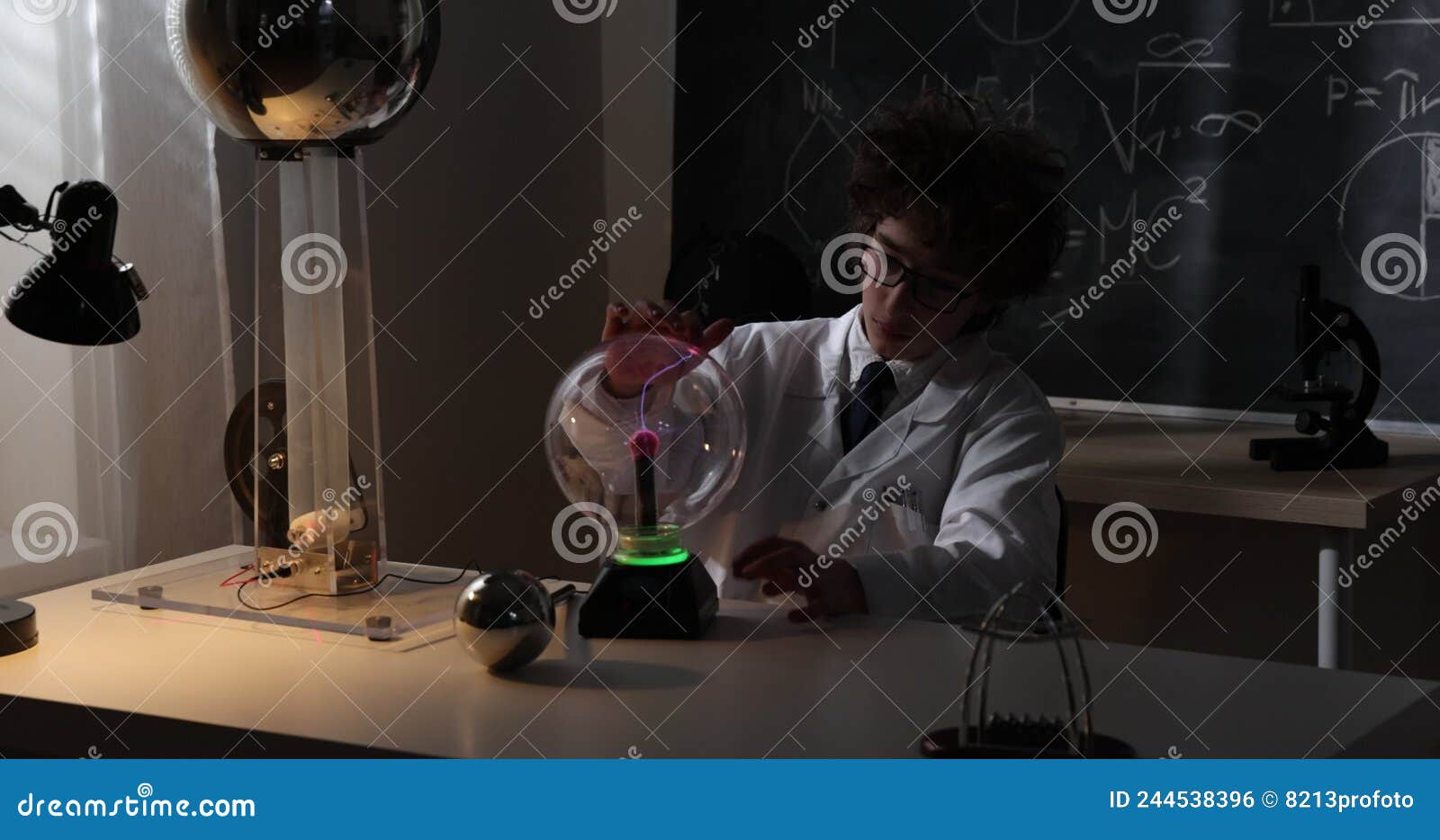 Schoolboy Experimenting in Physics Class. Young Student Doing Physics ...