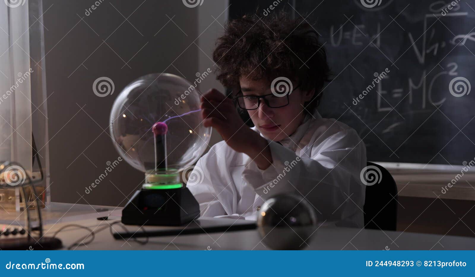 Schoolboy Experimenting in Physics Class. Young Student Doing Physics ...