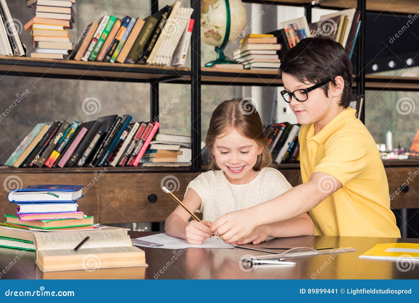 Schoolboy in Eyeglasses Helping Classmate in Doing Homework Stock Image ...