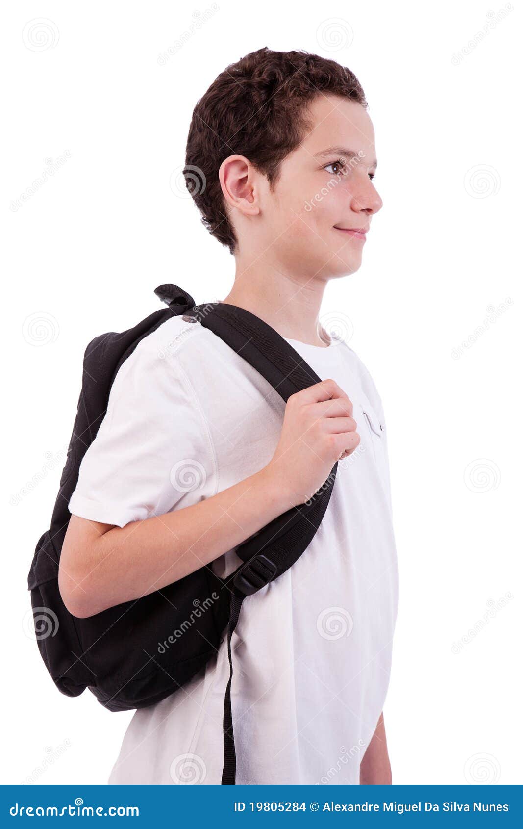 Schoolboy holding backpack stock photo. Image of teen - 19805284