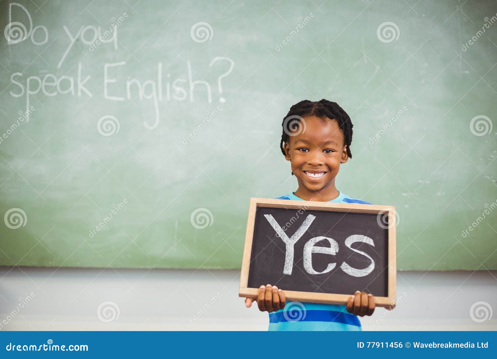 Schoolboy Holding a Slate in Classroom Which Reads Yes Stock Photo ...