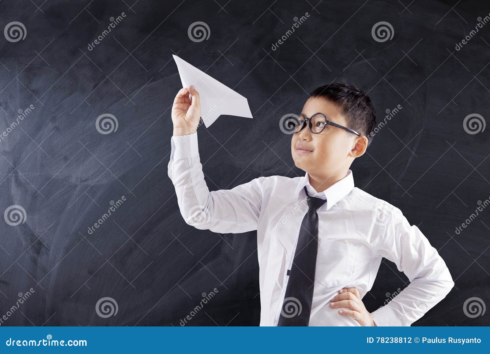 Schoolboy Holds Paper Plane Stock Photo - Image of male, hispanic: 78238812