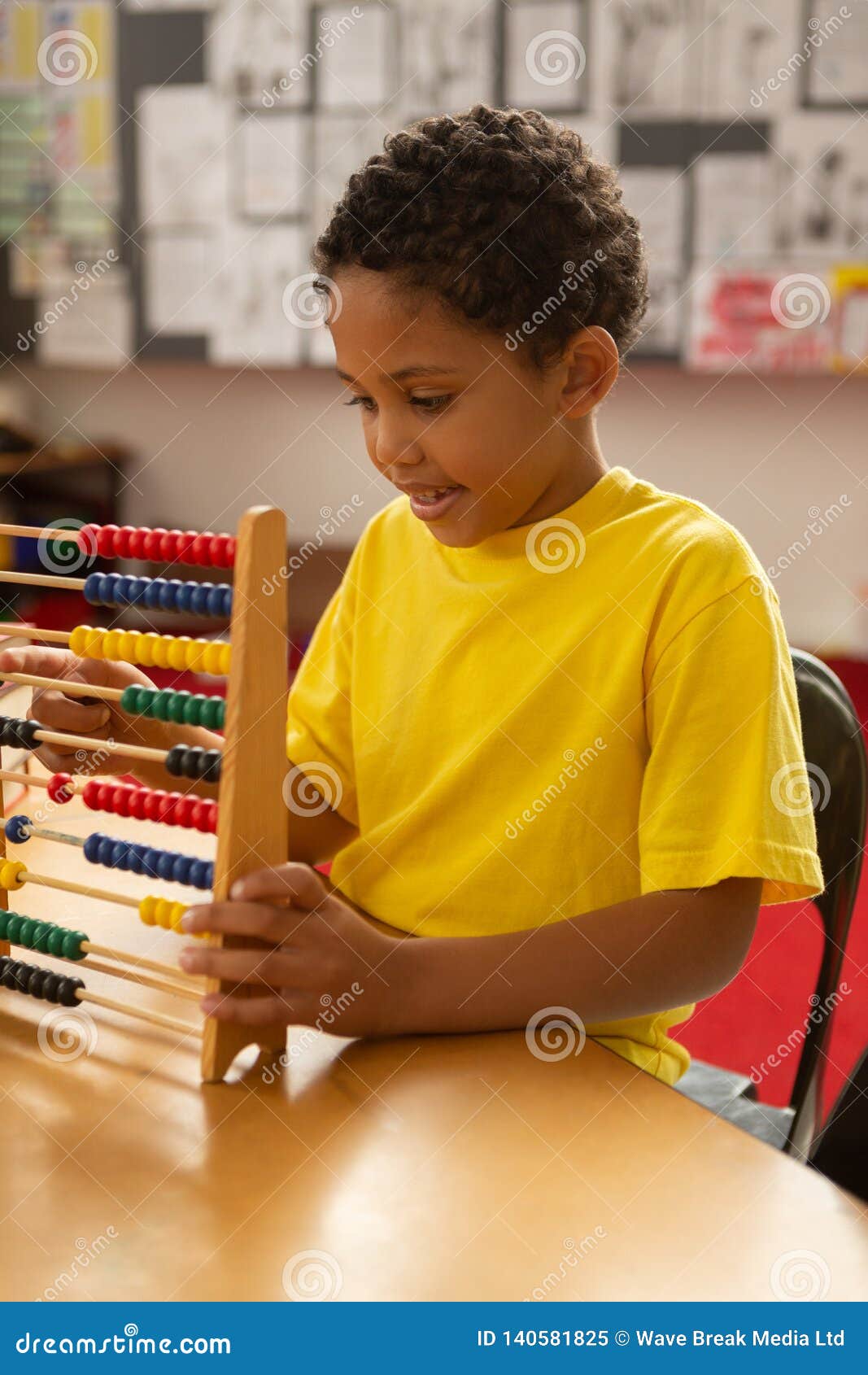 Schoolboy Learning Mathematics with Abacus in a Classroom Stock Image ...