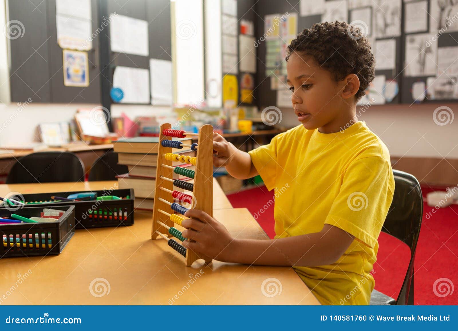 Schoolboy Learning Mathematics with Abacus in a Classroom Stock Photo ...
