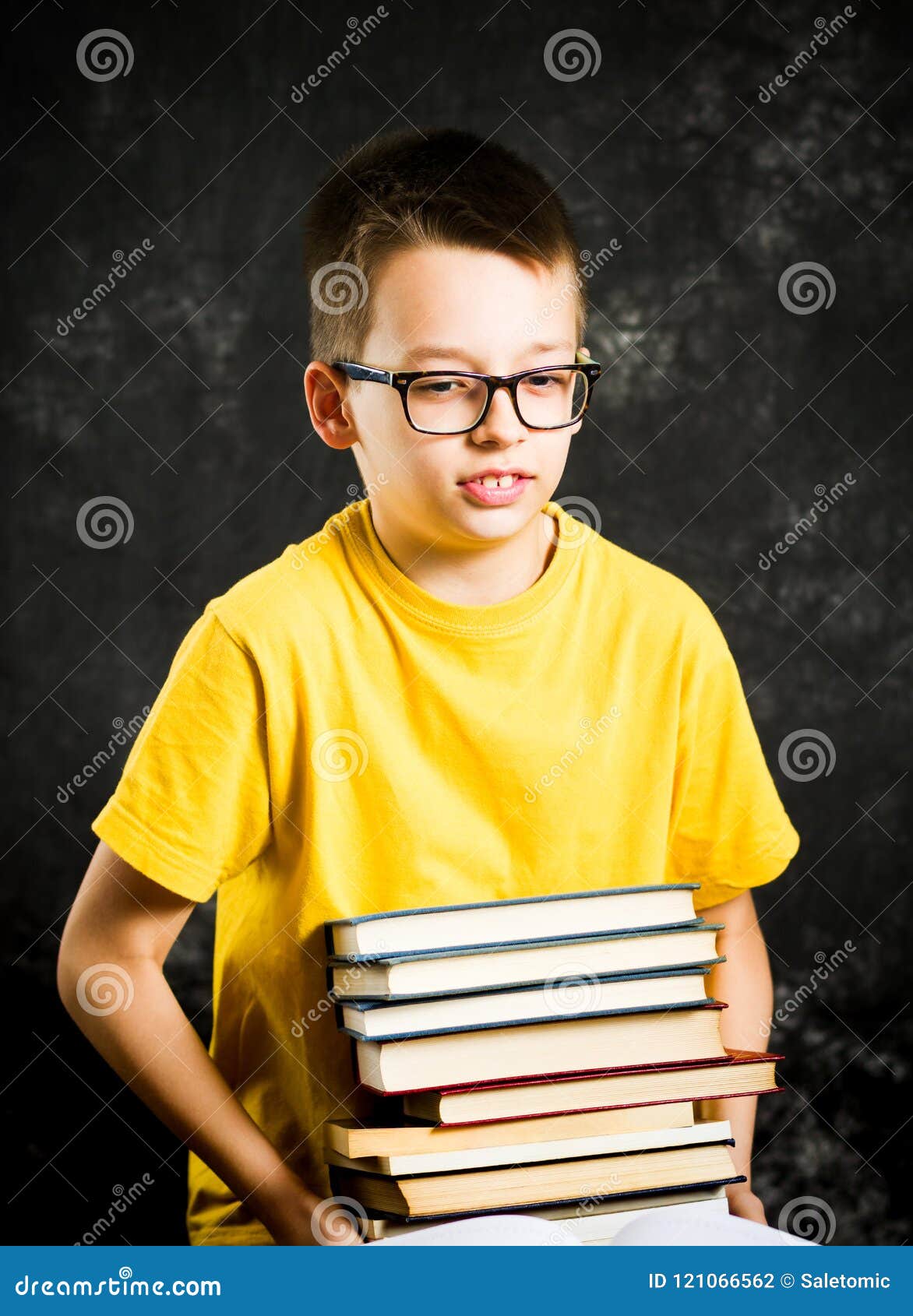 Schoolboy Lifting a Big Pile of Books Stock Photo - Image of kids ...