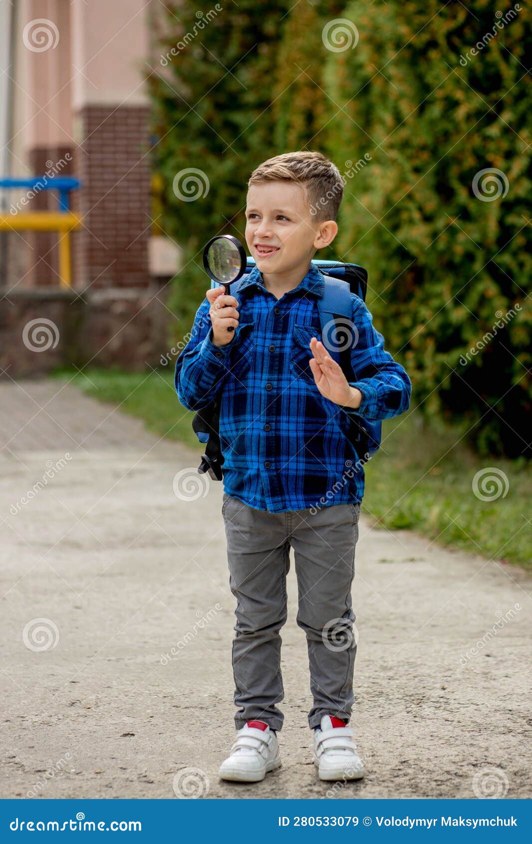 Schoolboy Looking through a Magnifying Glass, with a Surprised ...