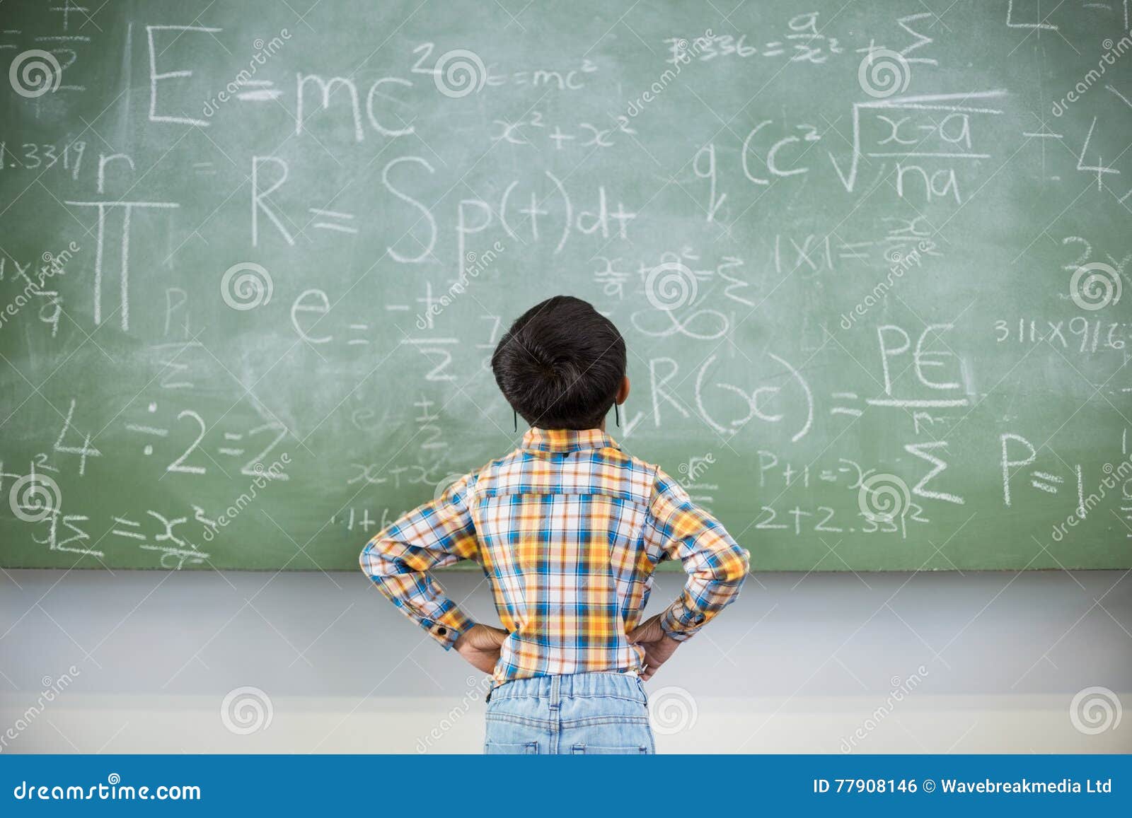 Schoolboy Looking Mathematics on Chalkboard in Classroom Stock Photo ...
