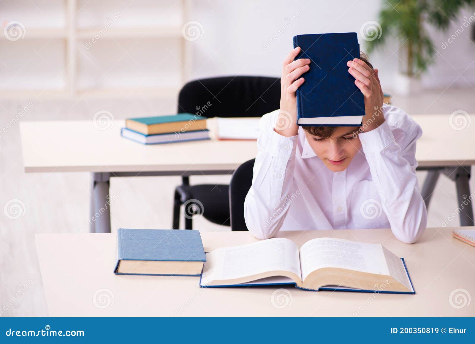 Schoolboy Preparing for Exams in the Classroom Stock Image - Image of ...