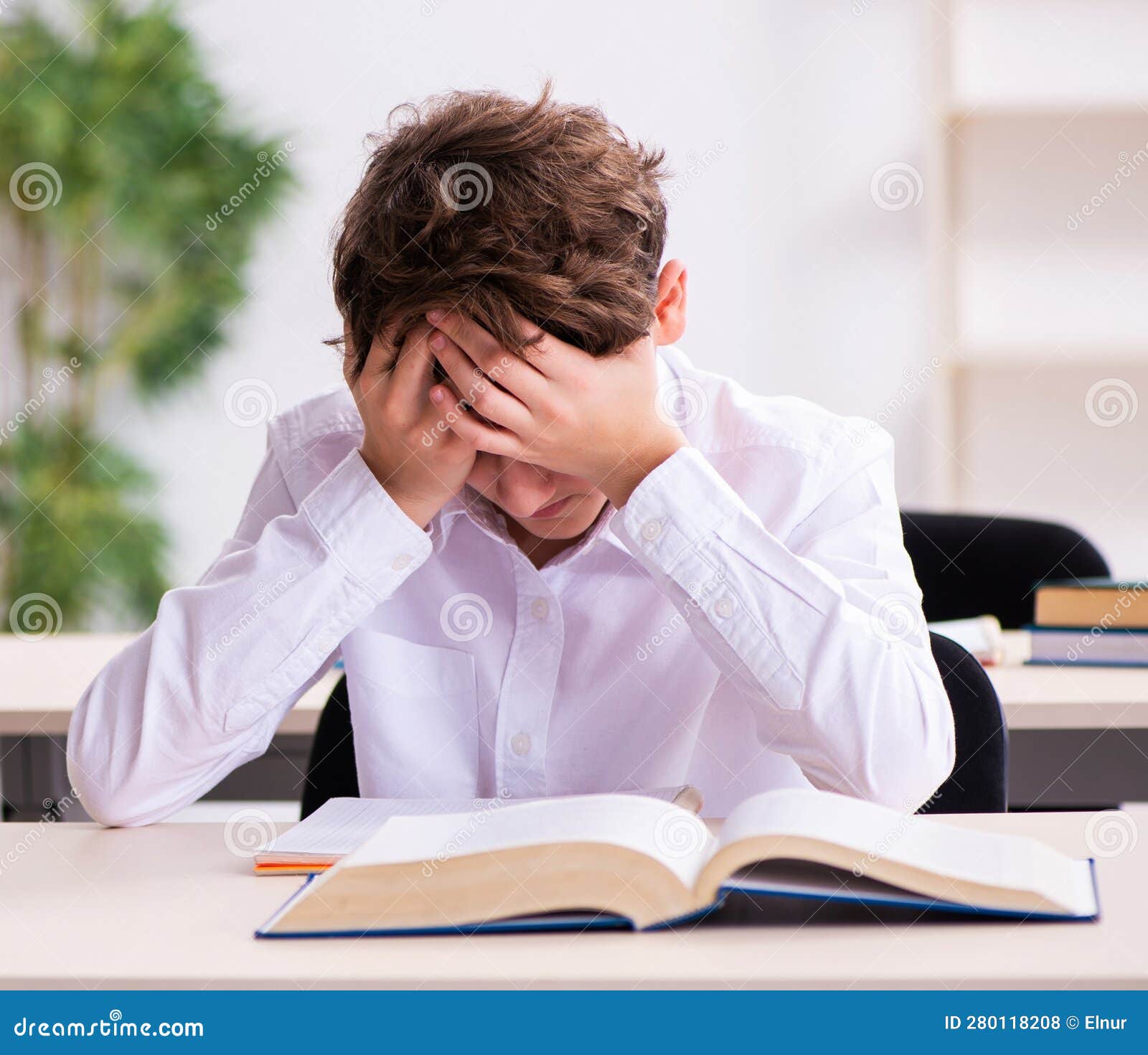 Schoolboy Preparing for Exams in the Classroom Stock Photo - Image of ...