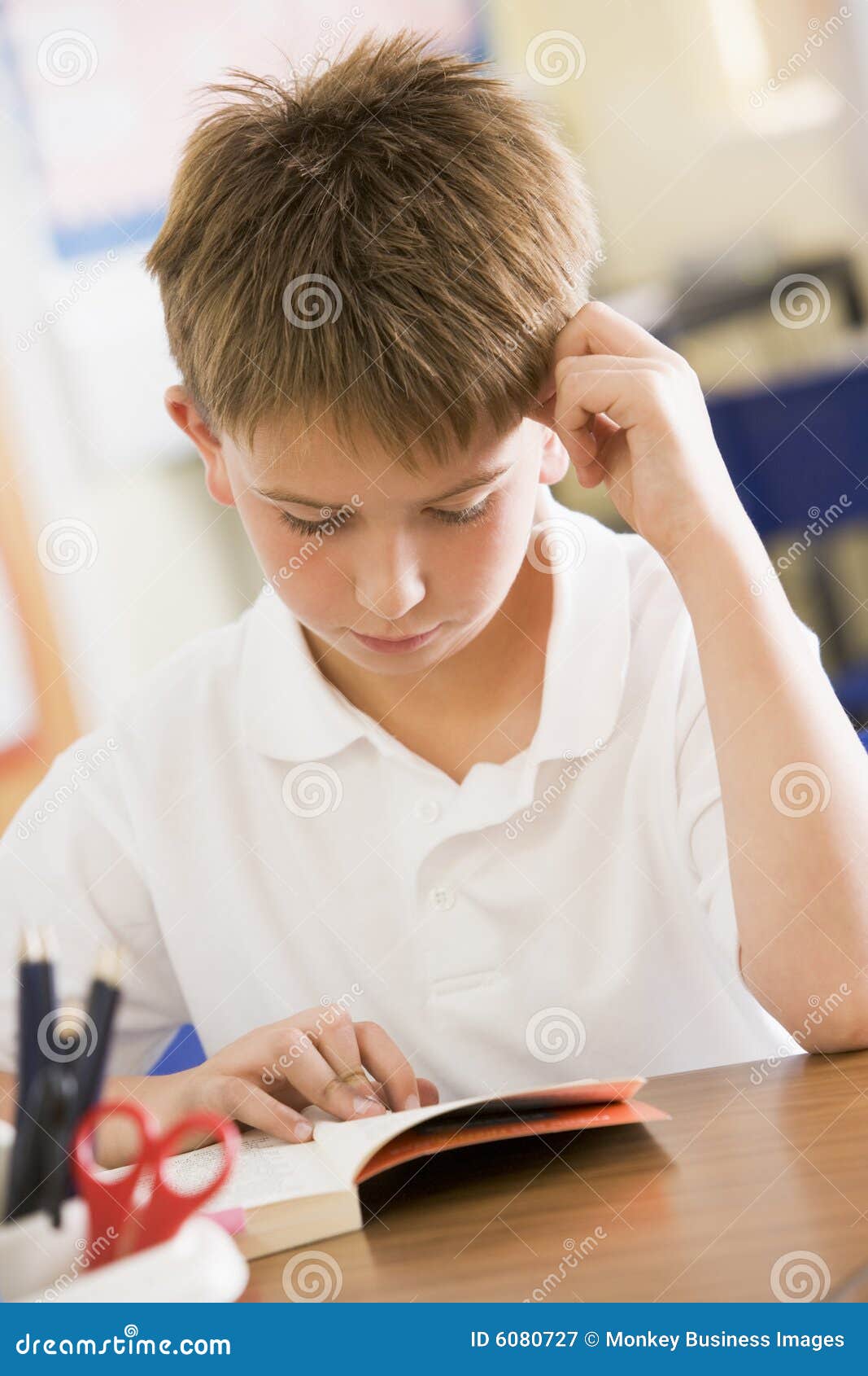 Schoolboy Reading a Book in Class Stock Image - Image of literacy ...