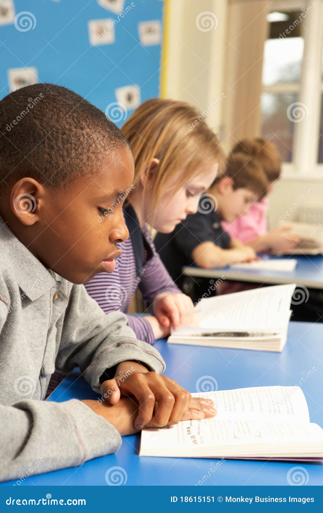Schoolboy Reading Book in Classroom Stock Image - Image of clothing ... Schoolboy Reading Book in Classroom Stock Image - Image of clothing ...