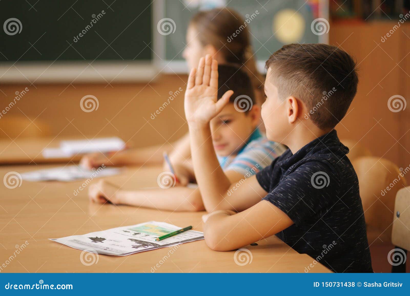 Schoolboy Rise Hand in Classroom. Elementary School Stock Photo - Image ...
