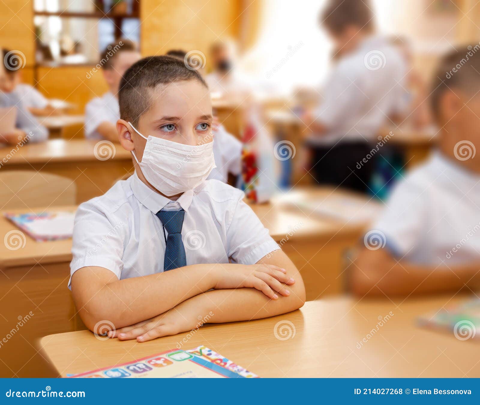 Schoolboy Sitting in Class. Boy Doing Schoolwork at Classroom Desks ...