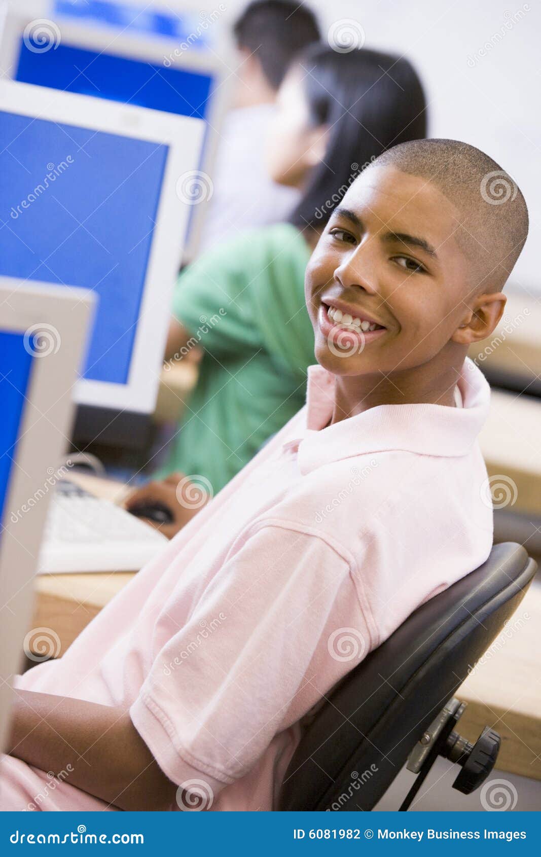 Schoolboy Sitting in Front of a Computer Stock Photo - Image of looking ...