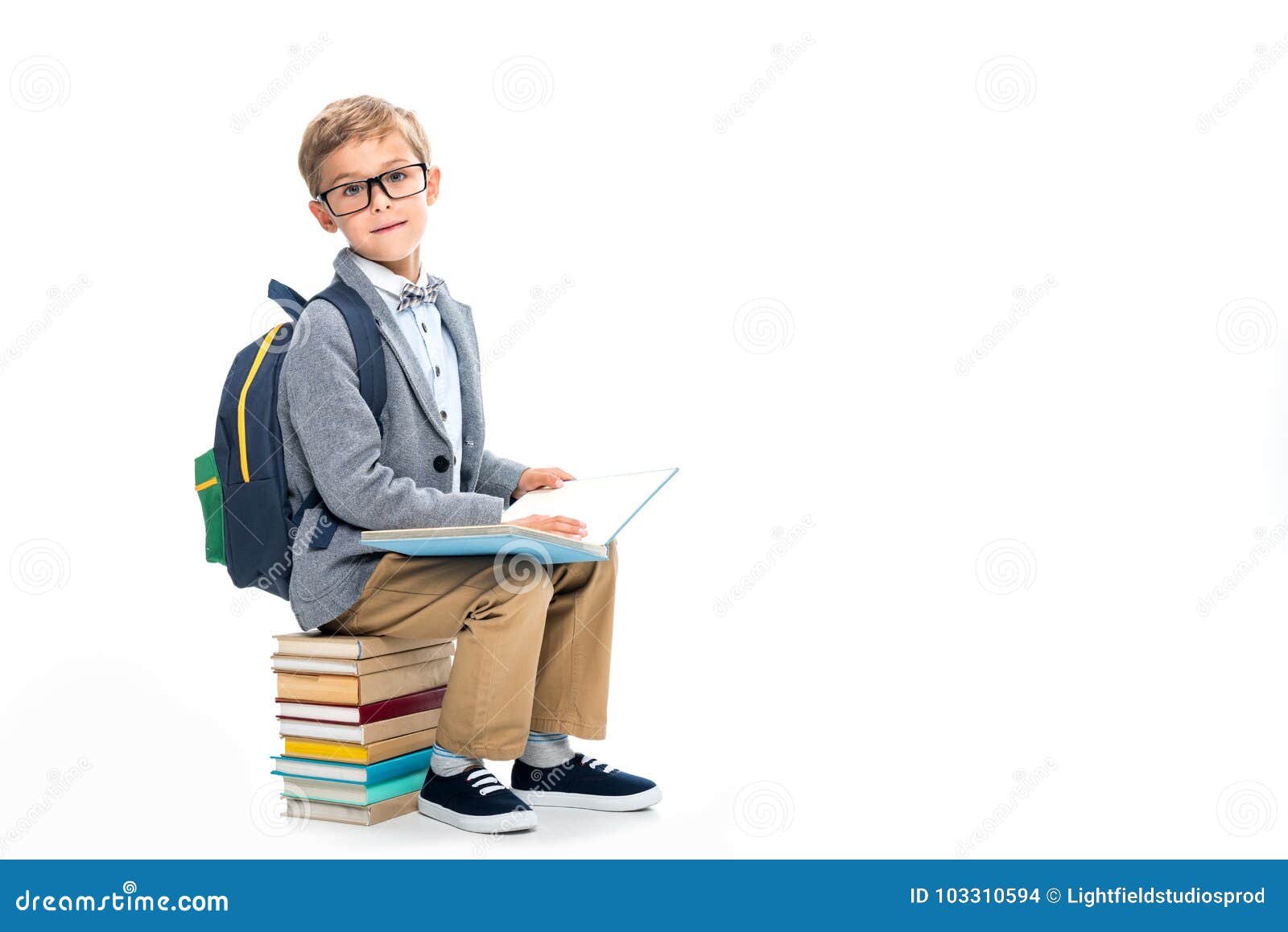 Schoolboy Sittting on Stack of Books and Reading Stock Photo - Image of ...