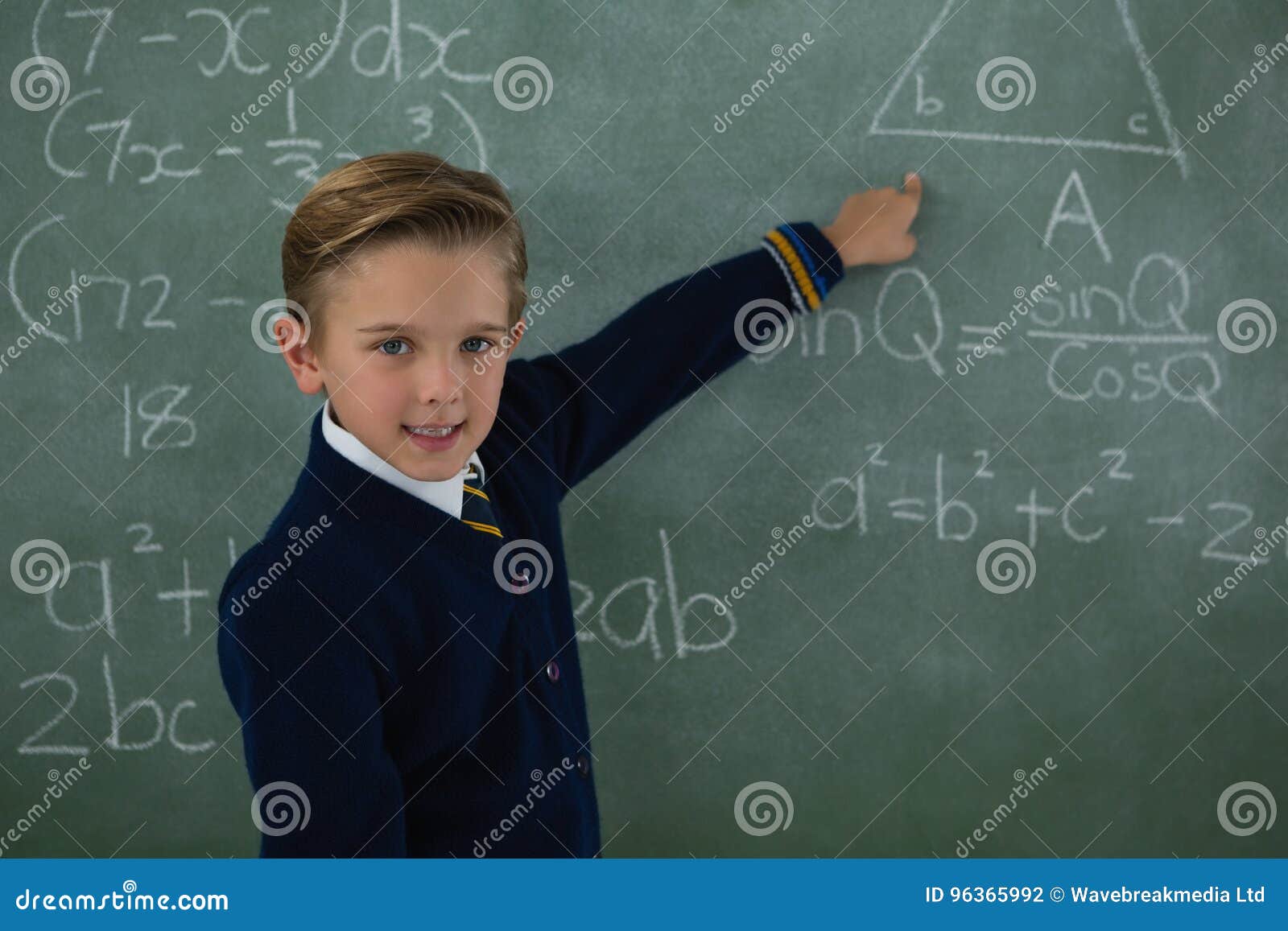 Schoolboy Solving Maths Formula on Chalkboard Stock Photo - Image of ...