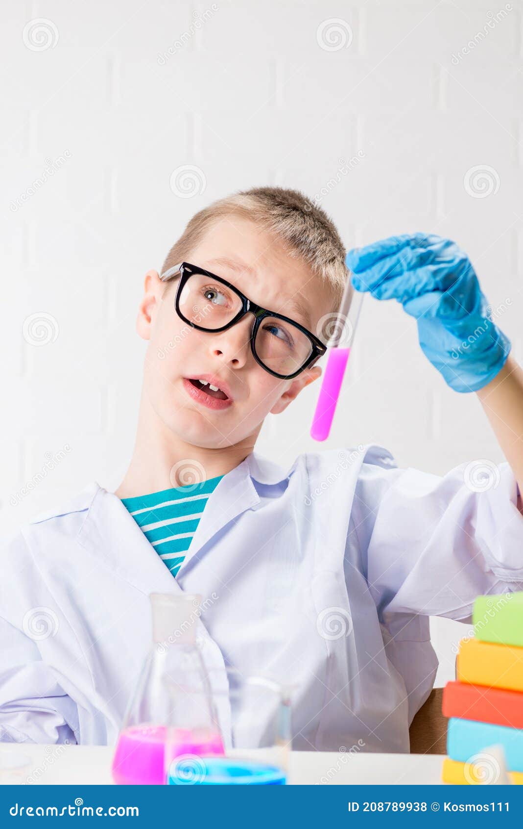 A Schoolboy Studies Multi-colored Substances in Test Tubes, Conducts ...