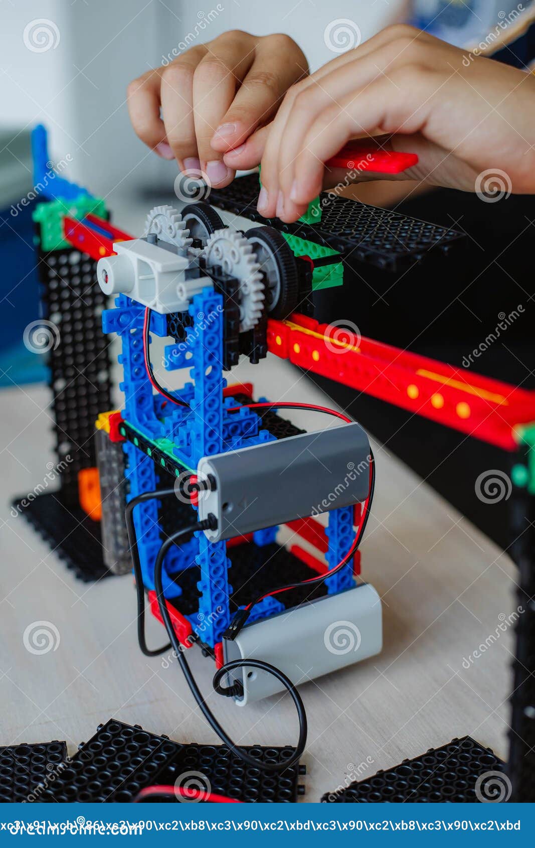 Schoolboy Study in a Robotics Class, Assemble a Robot Constructor ...
