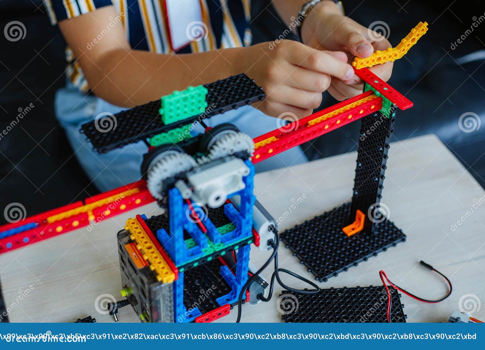 Schoolboy Study in a Robotics Class, Assemble a Robot Constructor ...