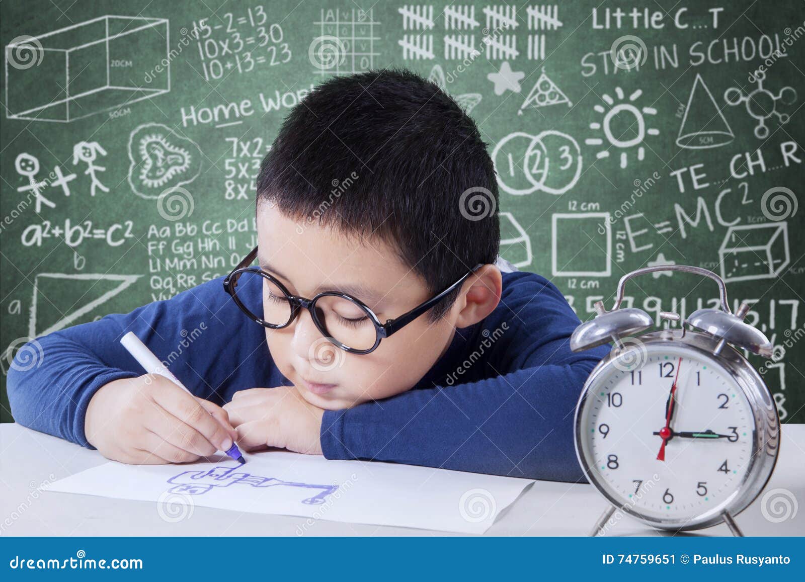 Schoolboy Studying with a Clock on the Table Stock Image - Image of ...
