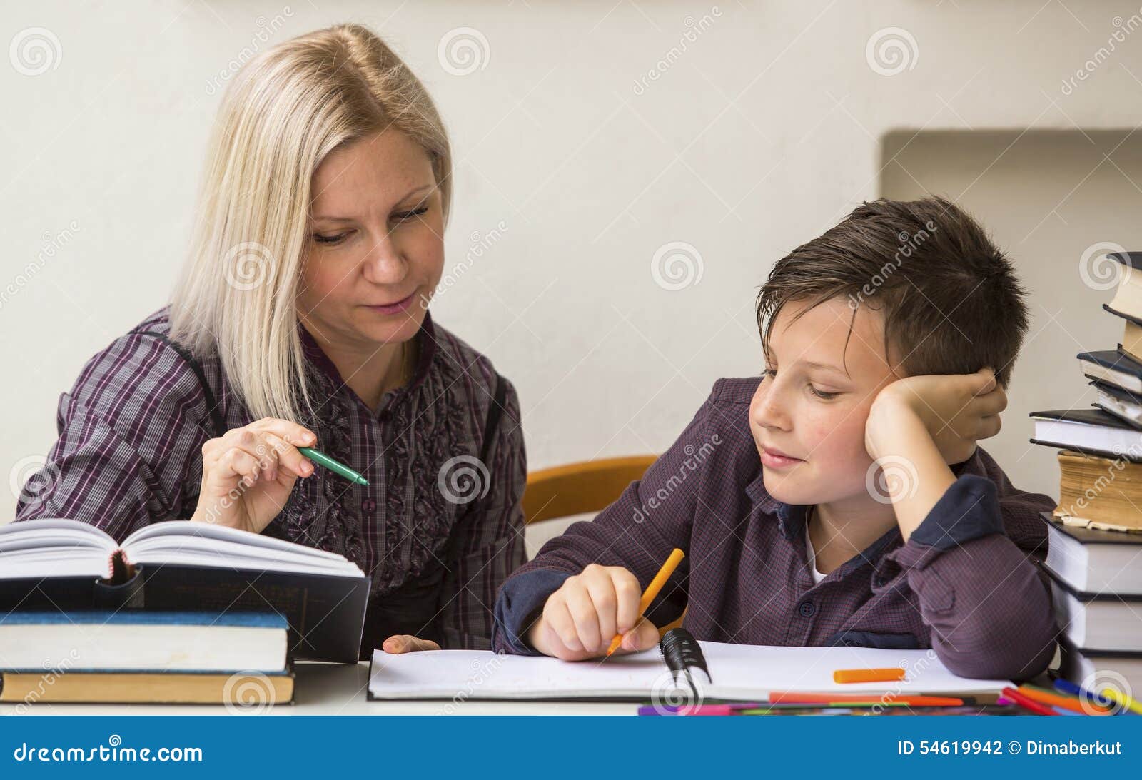 Schoolboy Studying with the Help of a Tutor. Education. Stock Photo ...