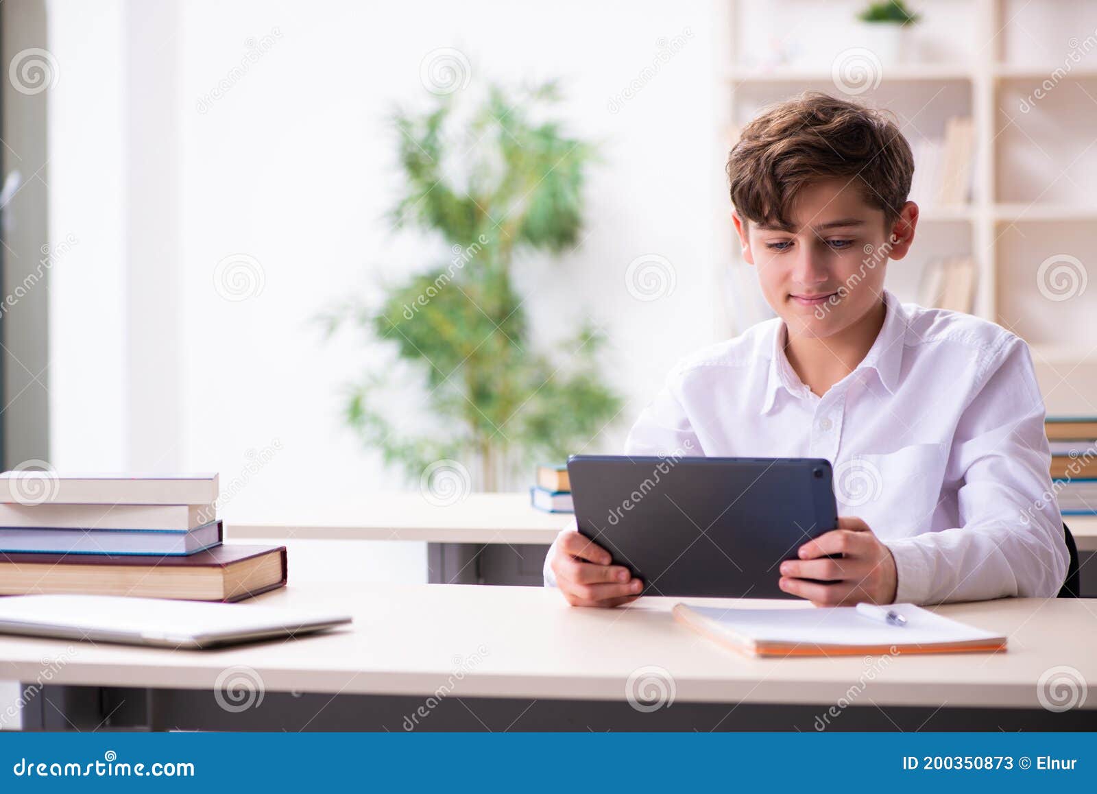 Schoolboy in Tele-education Concept in the Classroom Stock Image ...